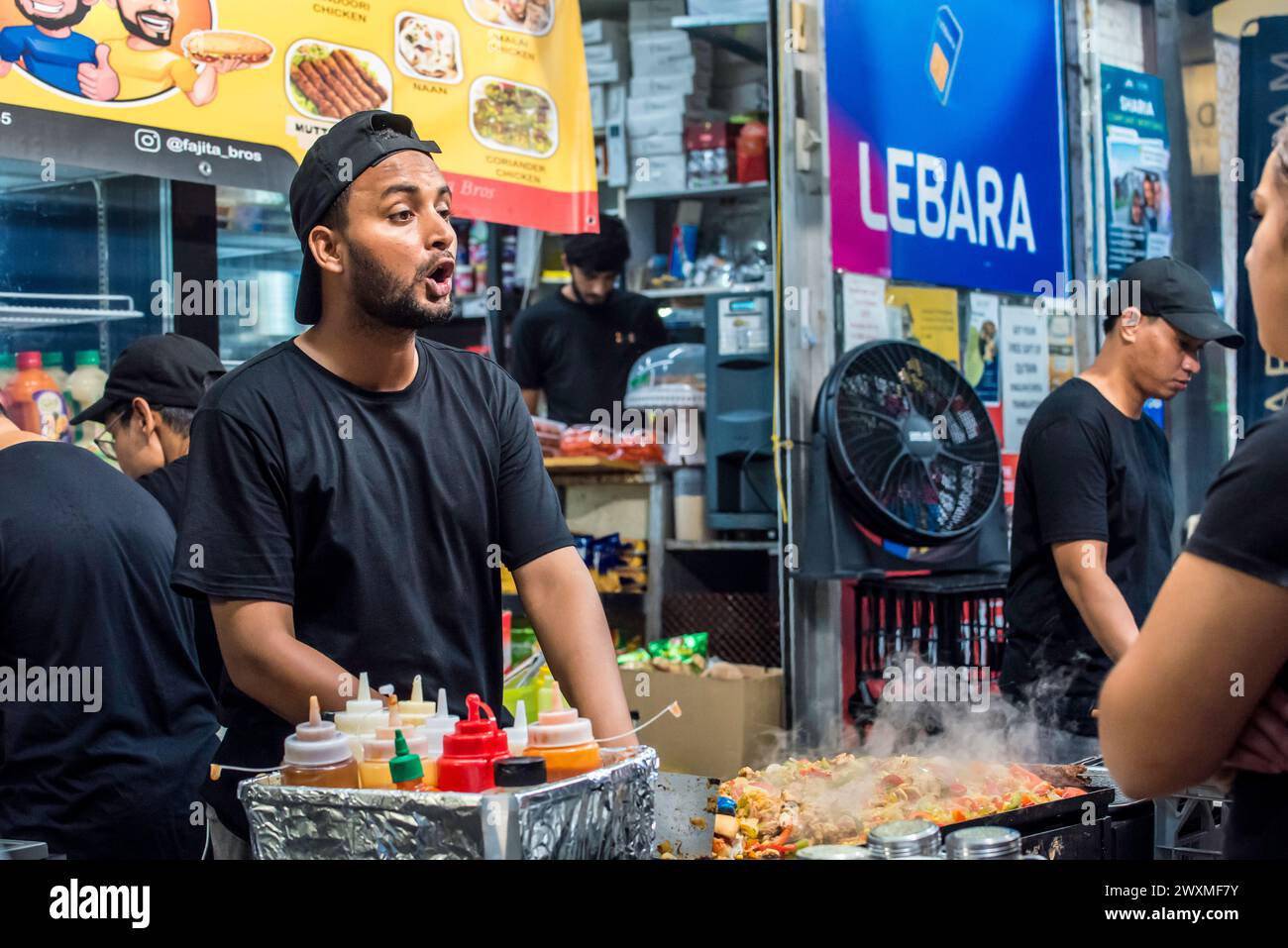 A man shouting while cooking fajitas at Lakemba, Sydney, Australia ...