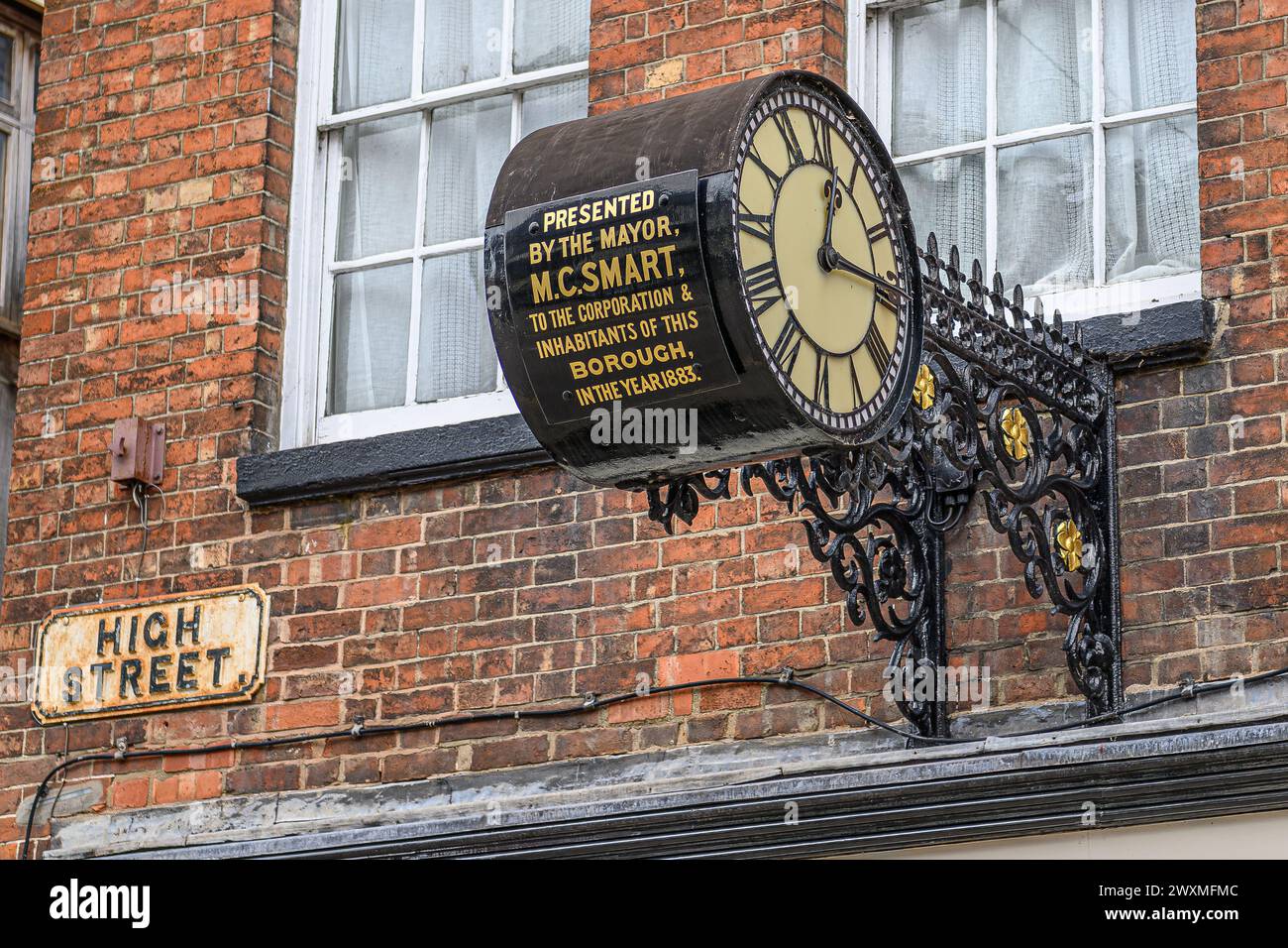 Clock on a wrought iron frame hi-res stock photography and images - Alamy