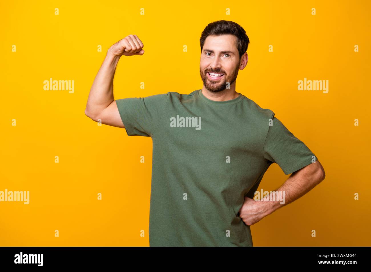 Full size photo of handsome young guy show hand muscle biceps wear ...