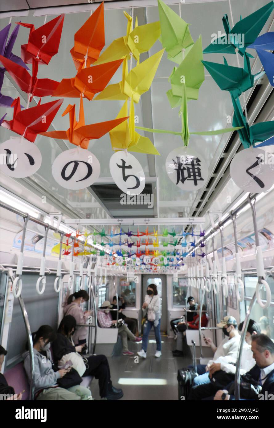 "Life Shining Origami Crane Train" is decorated with colorful origami ...