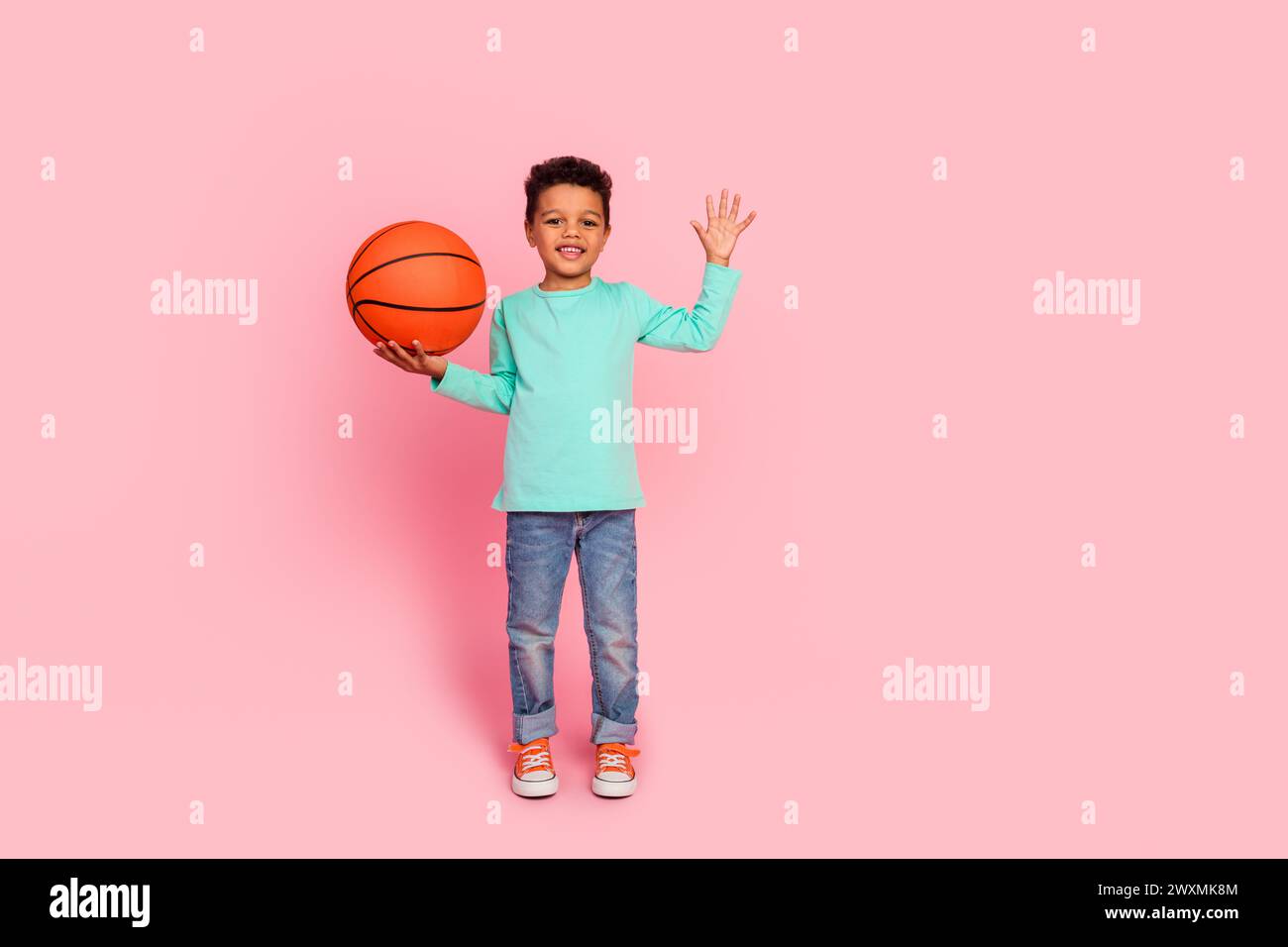 Full body photo of cute little boy hold basketball ball wave hand ...