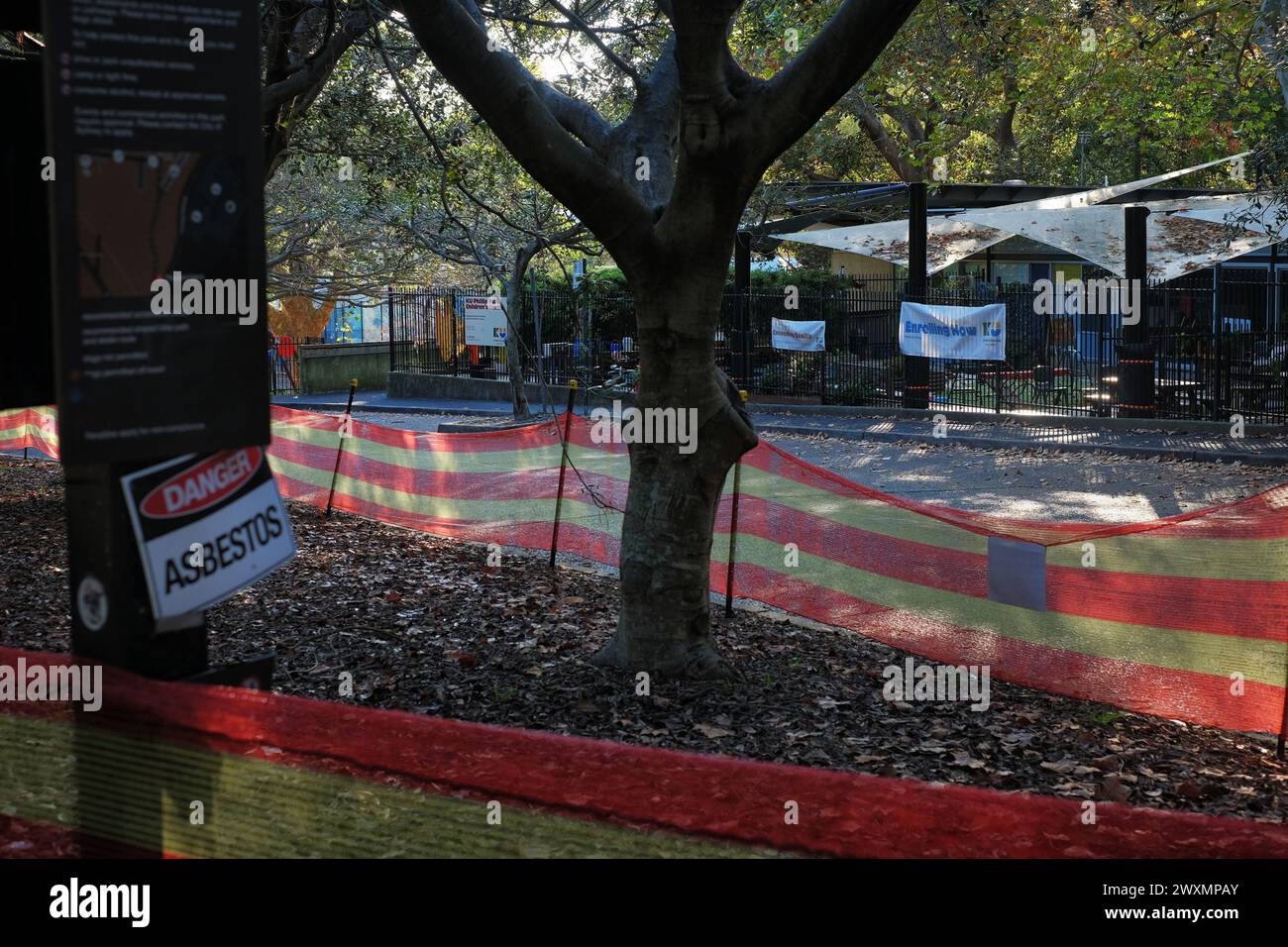 Danger Asbestos near a children's day-care, hazard fencing around ...
