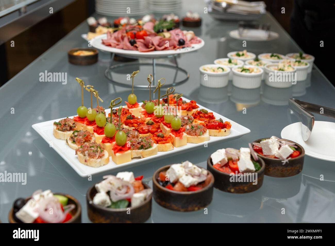 Buffet table with cold appetizers and salads. Buffet food, catering ...