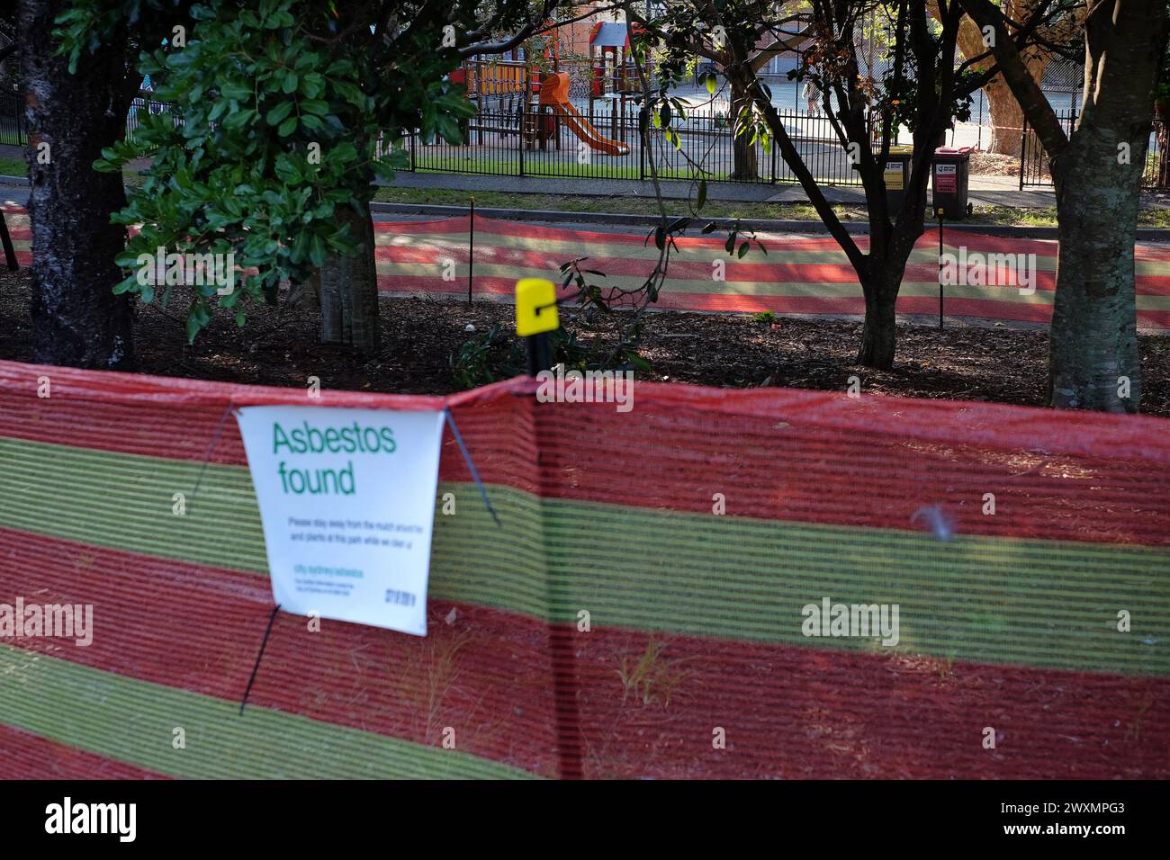 Asbestos Found, hazard fencing around garden beds near a children's ...