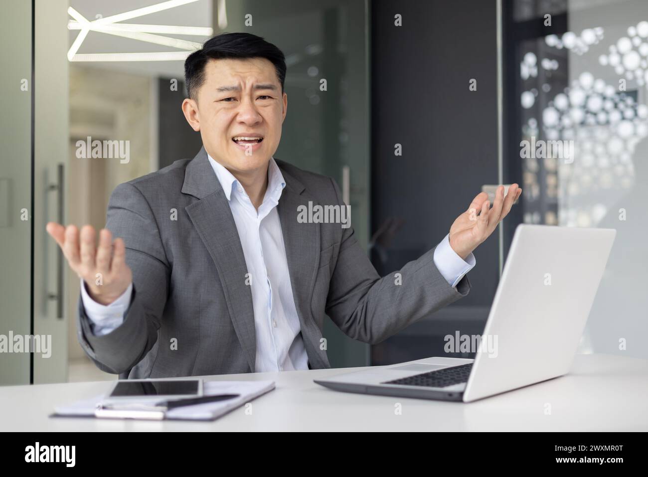 Asian confused man in a suit hi-res stock photography and images - Alamy