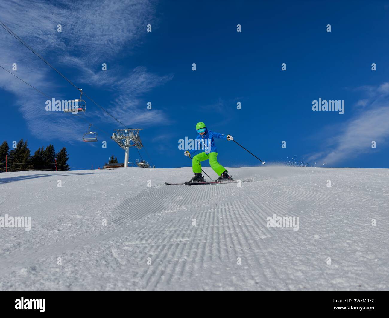Happy kid in dynamic ski slope moment at alpine mountain resort Stock ...