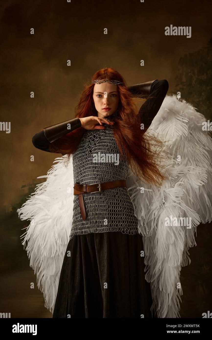 Red-haired woman with angel wings and chainmail, wearing a diadem ...