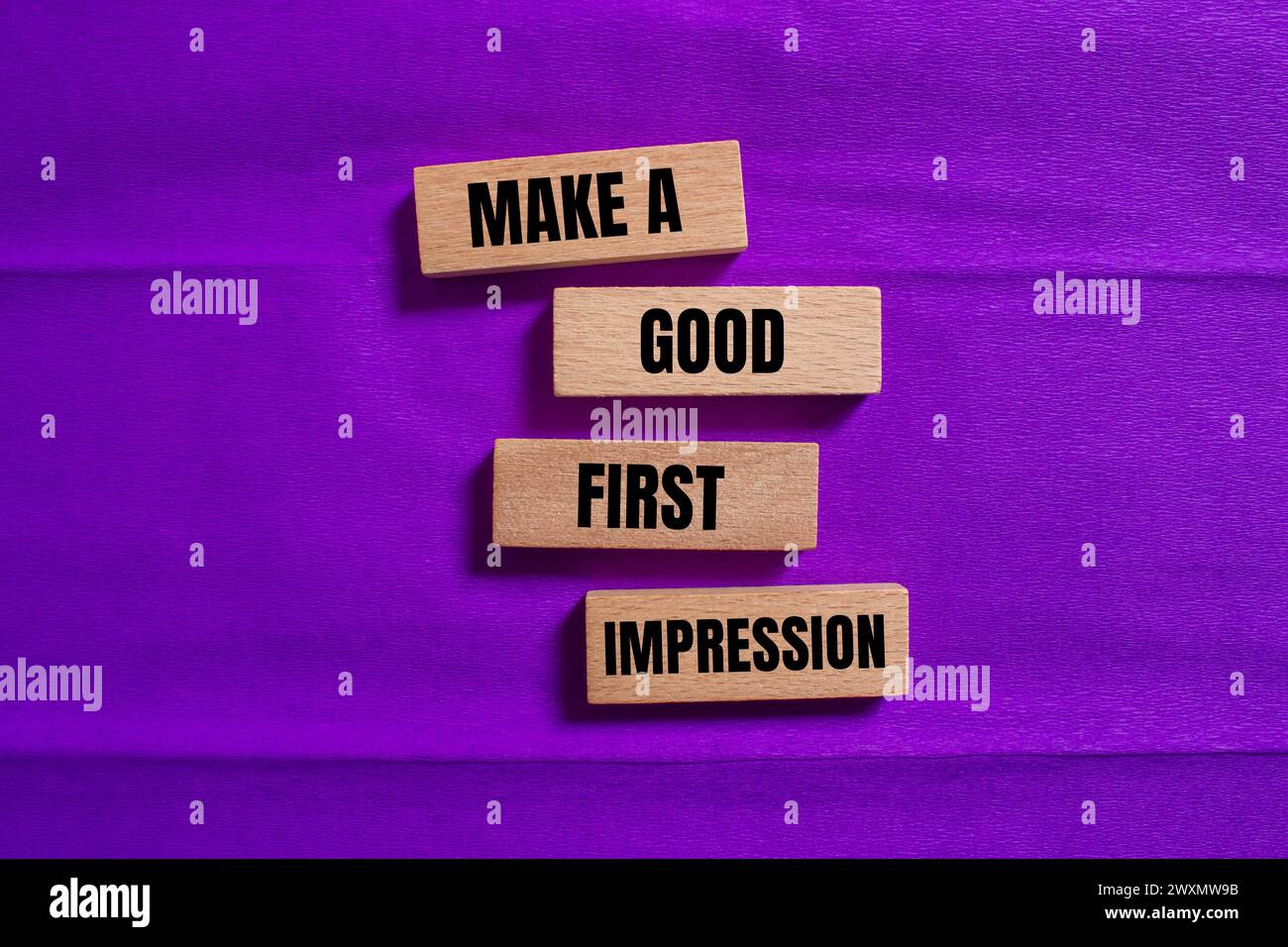 Make a good first impression words written on wooden blocks with purple ...