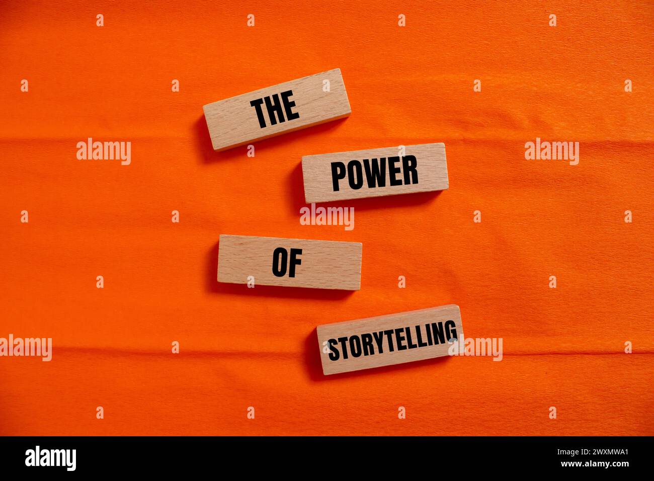 The power of storytelling words written on wooden blocks with orange ...