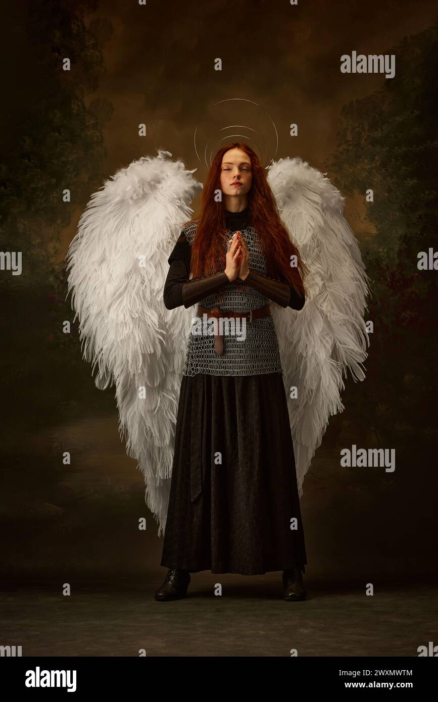 Red-haired maiden in angelic wings and medieval attire embodies a ...