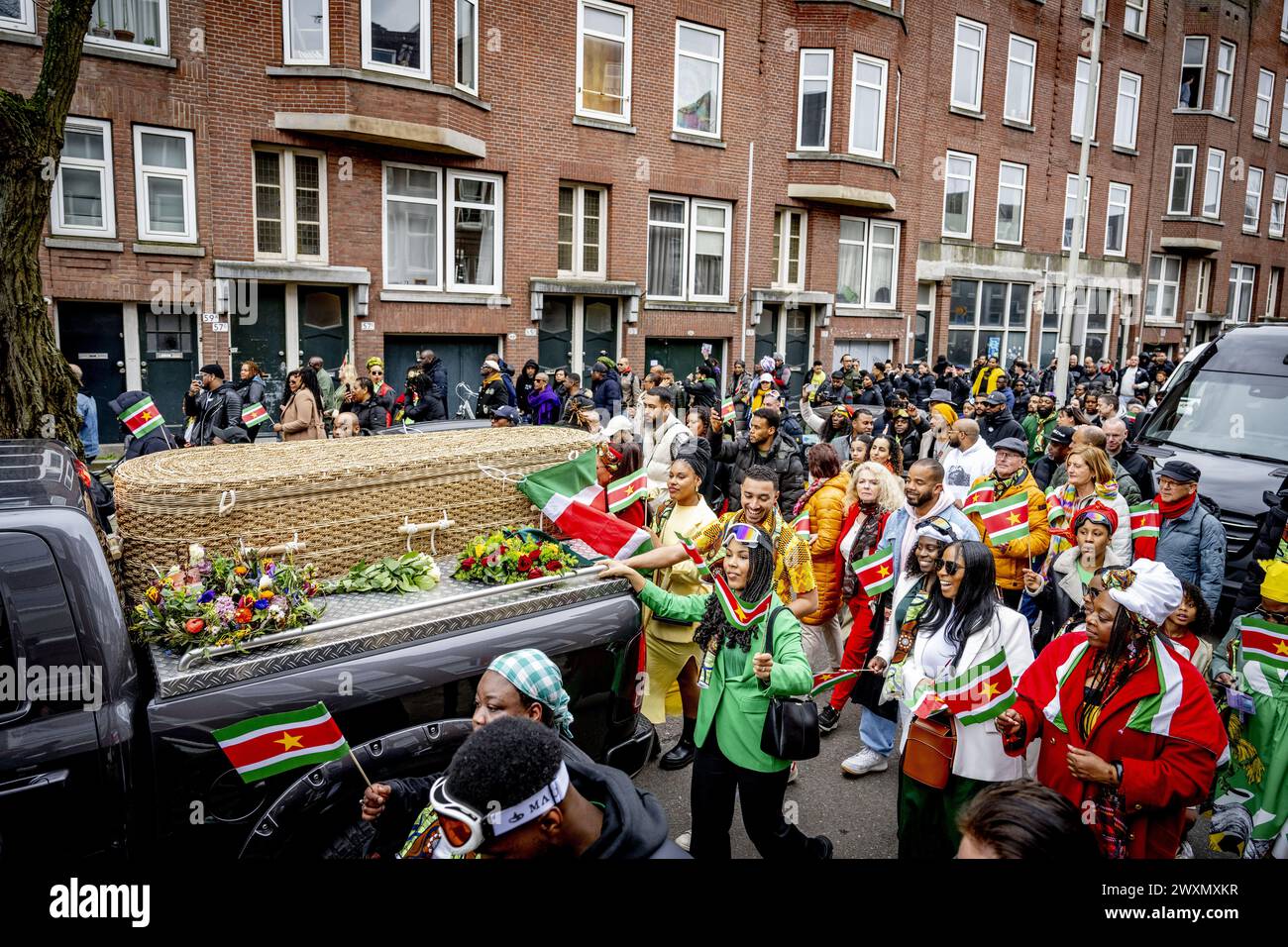 ROTTERDAM - The body of rapper Def Rhymz is driven around during a ...