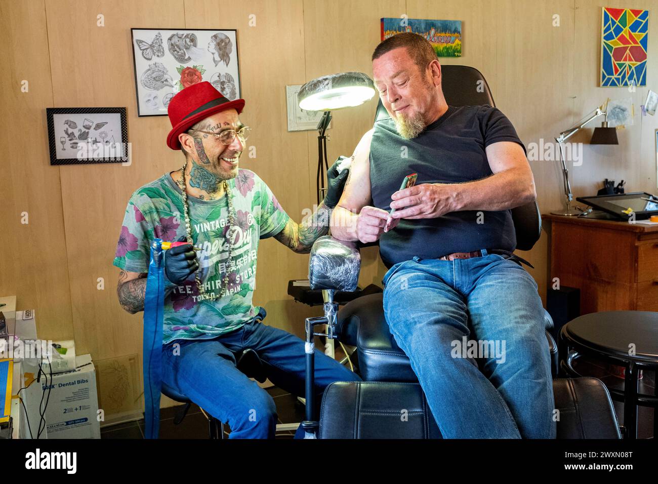 Getting a Tattoo Tilburg, Netherlands. Senior adult male getting a ...