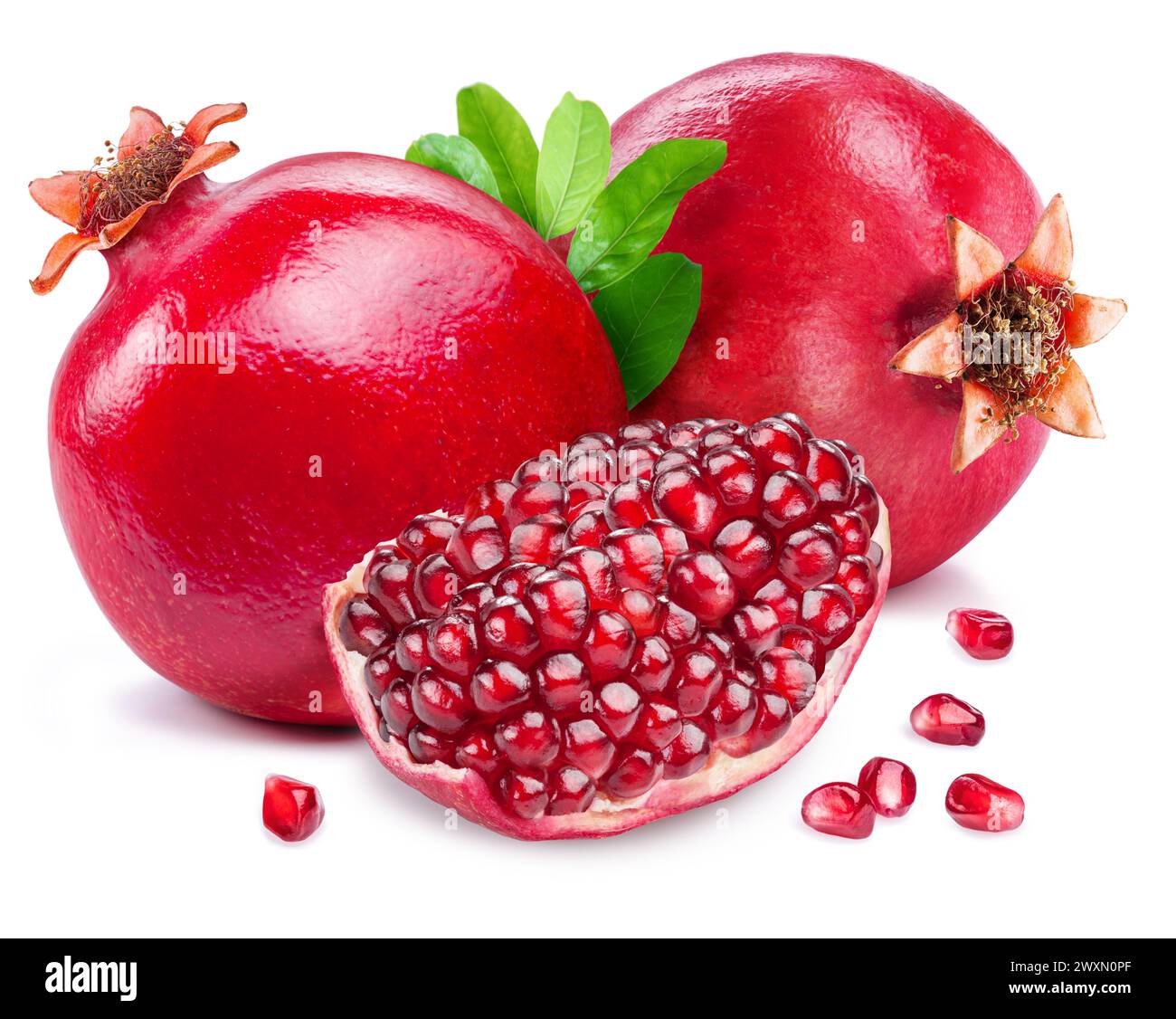 Whole pomegranate fruit with leaf and a piece with ripe red pomegranate ...