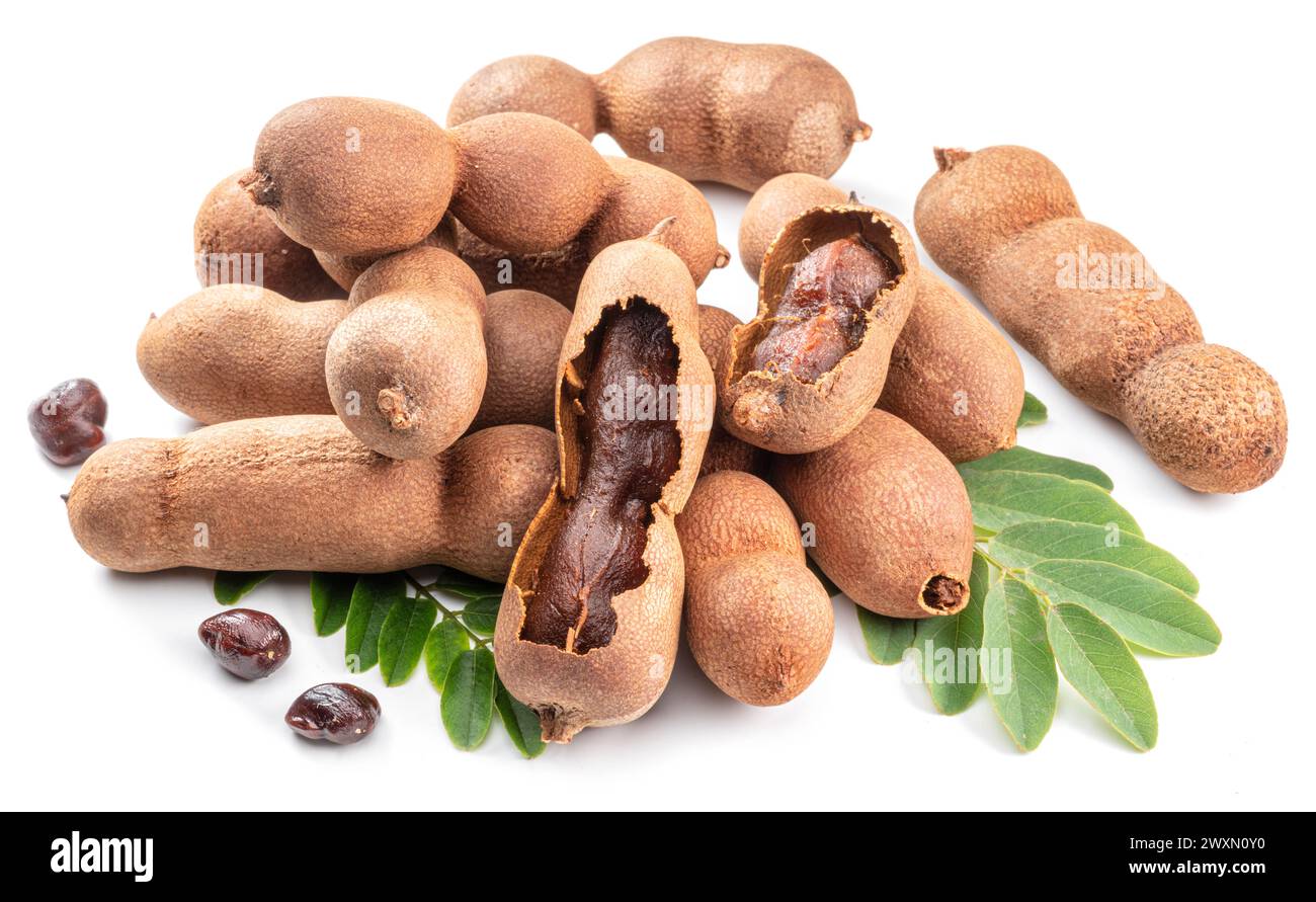 Ripe tamarind fruit and some tamarind seeds isolated on white ...