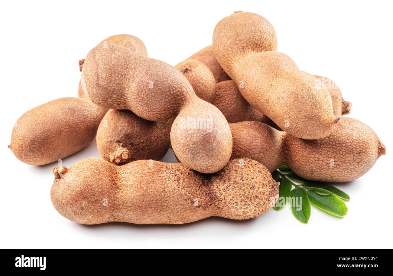 Tamarind fruit pods isolated on white background Stock Photo - Alamy