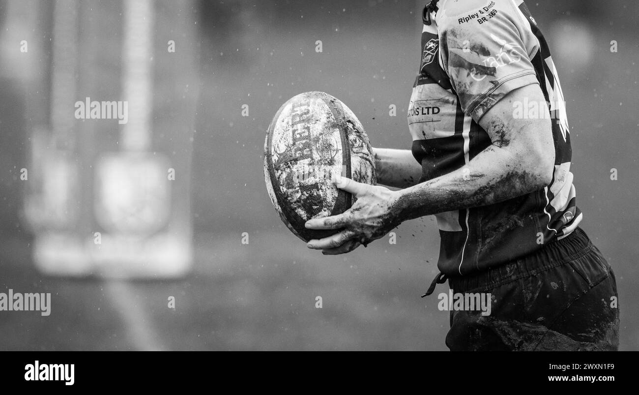 English amateur rugby union women's game playing in wet and muddy ...