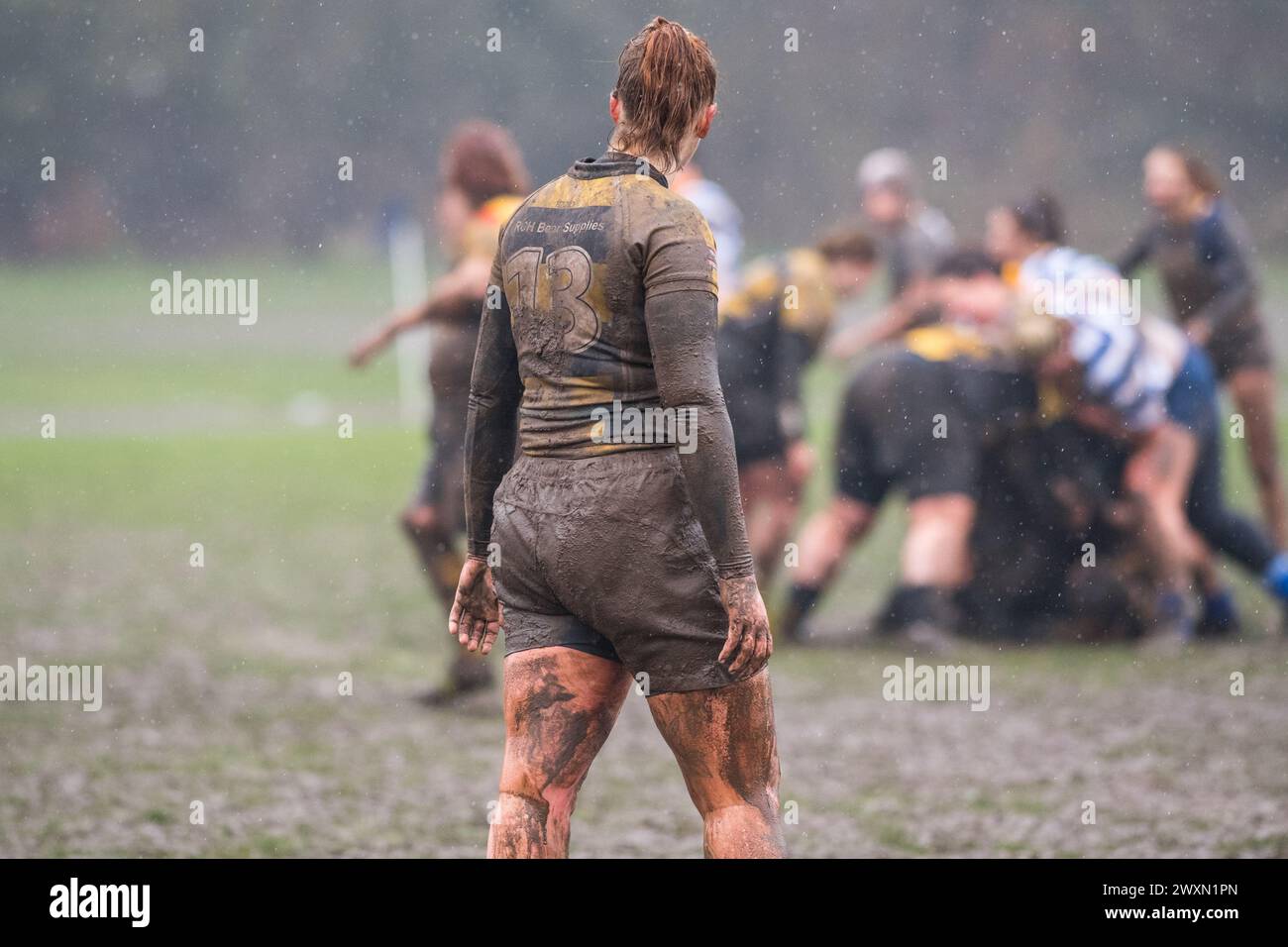 English amateur rugby union women's game playing in wet and muddy ...