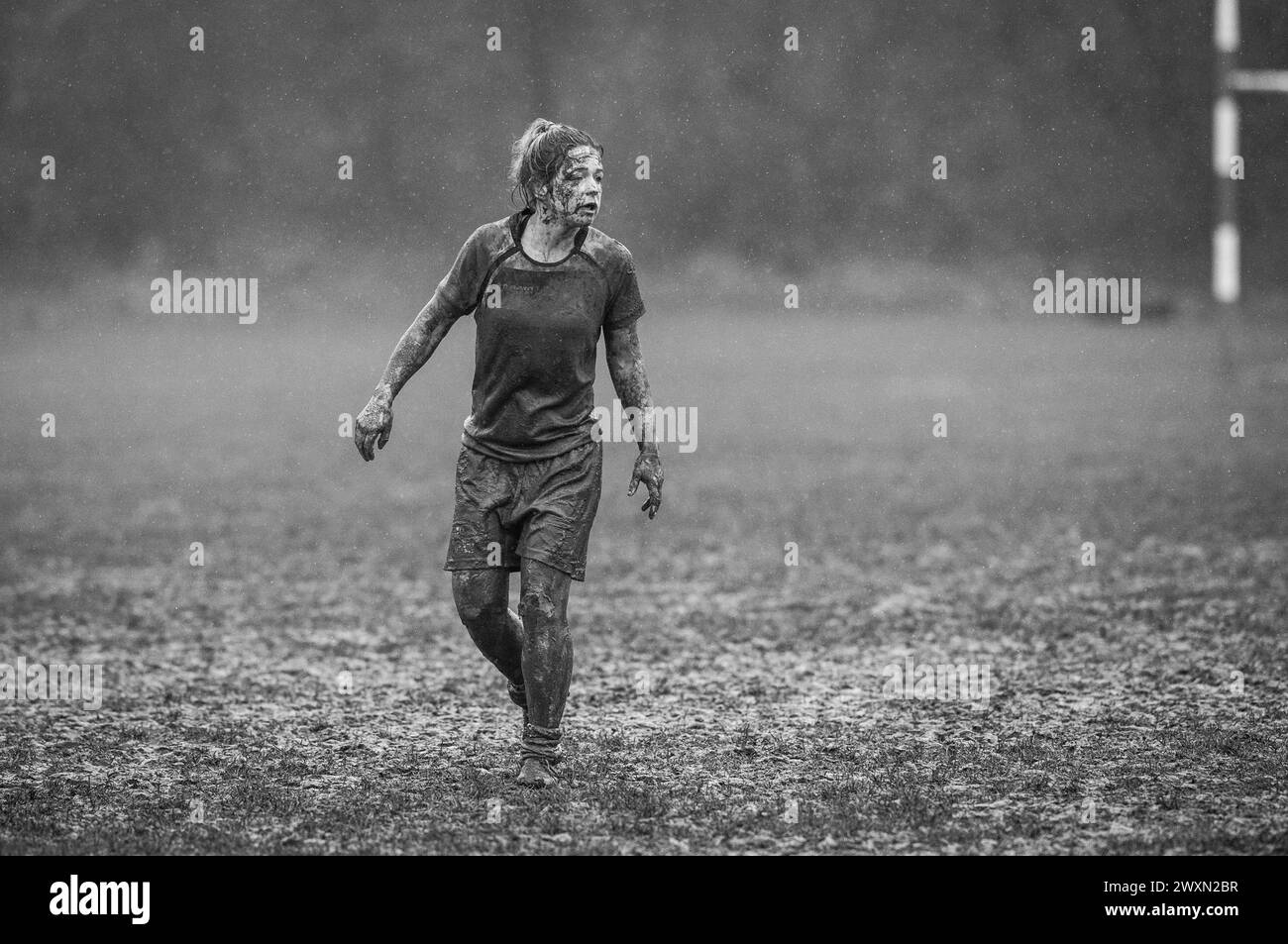 Playing rugby in mud Black and White Stock Photos & Images - Alamy