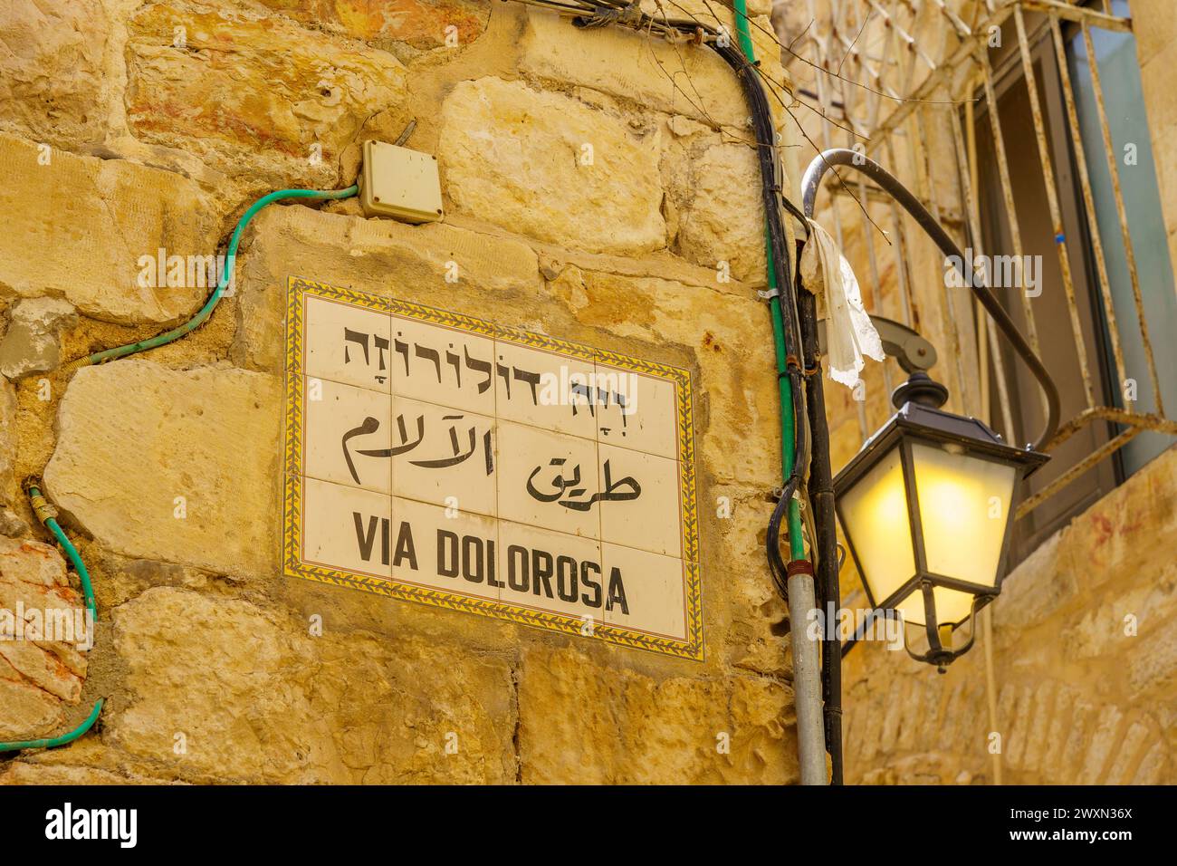 View of trilingual street signs of Via Dolorosa, and streetlamp. Old ...