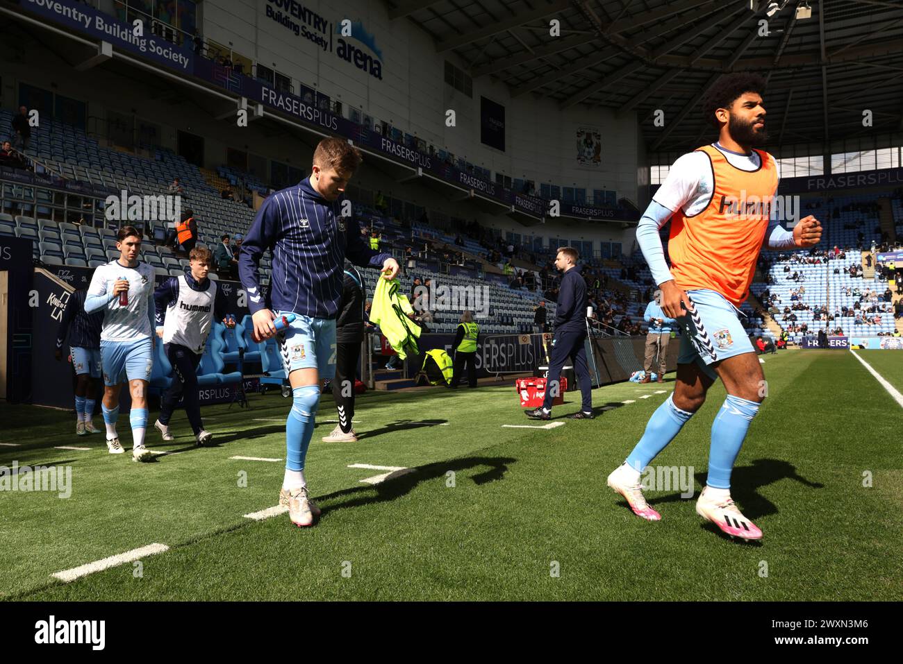 Coventry City players run onto the pitch for a warm up before the Sky ...