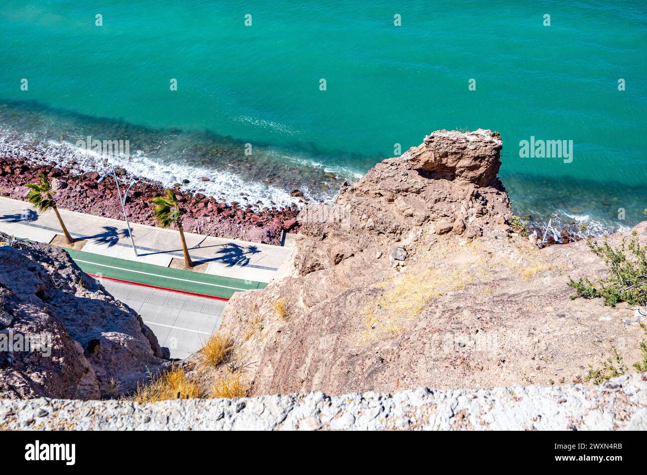 Aerial view of rock formation on arid terrain, road, boardwalk with ...