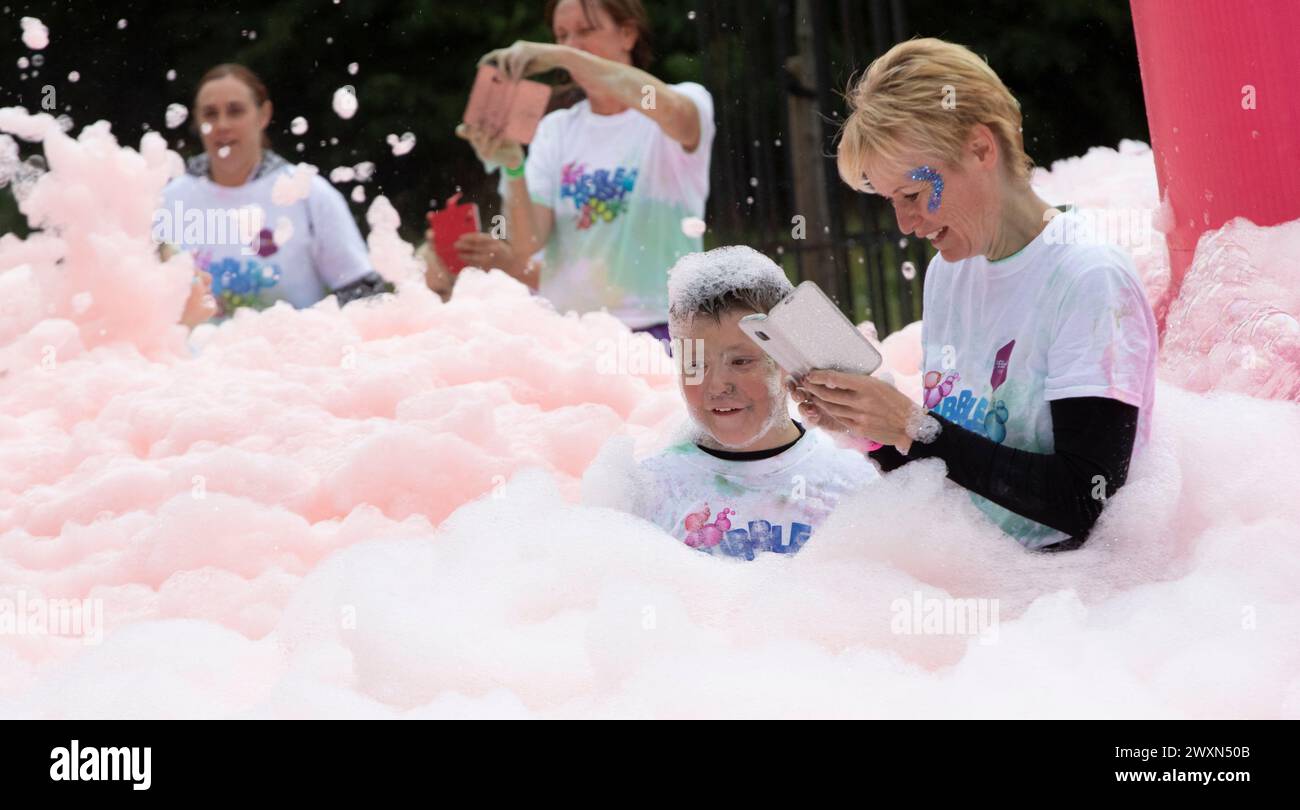 East Anglia Childrens Hospices (EACH) charity fundraiser Bubble Rush where fun seekers run, jog ...