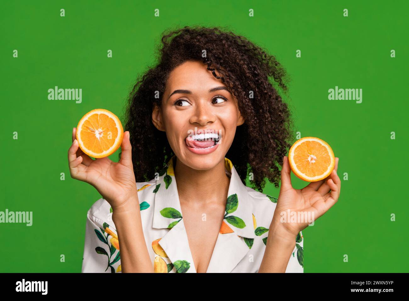 Photo of cheerful tricky woman dressed print shirt stick out rising two ...