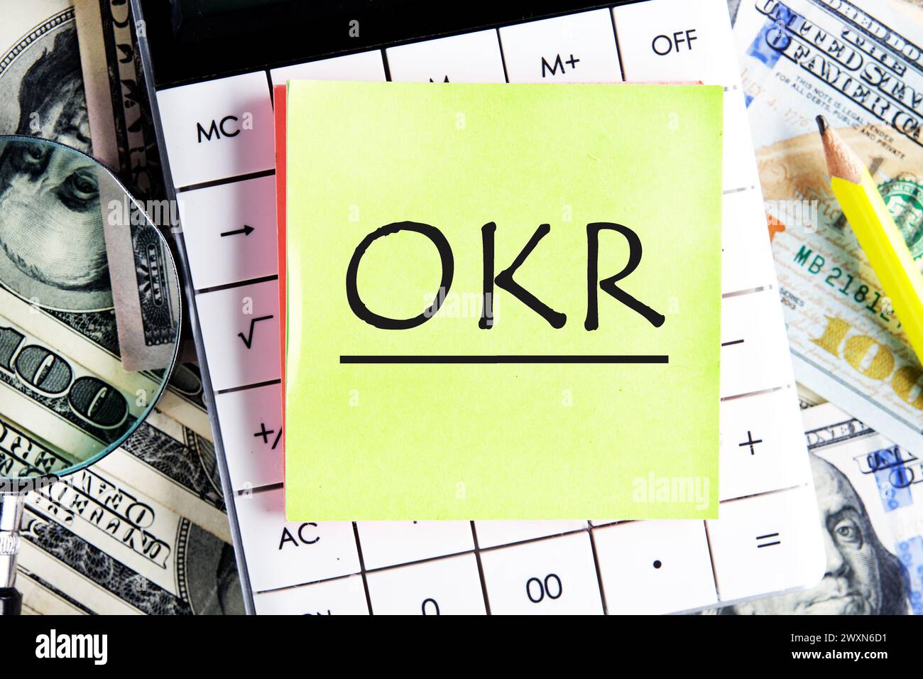OKR text (Objectives, Key and Results) on a yellow sticker on the ...