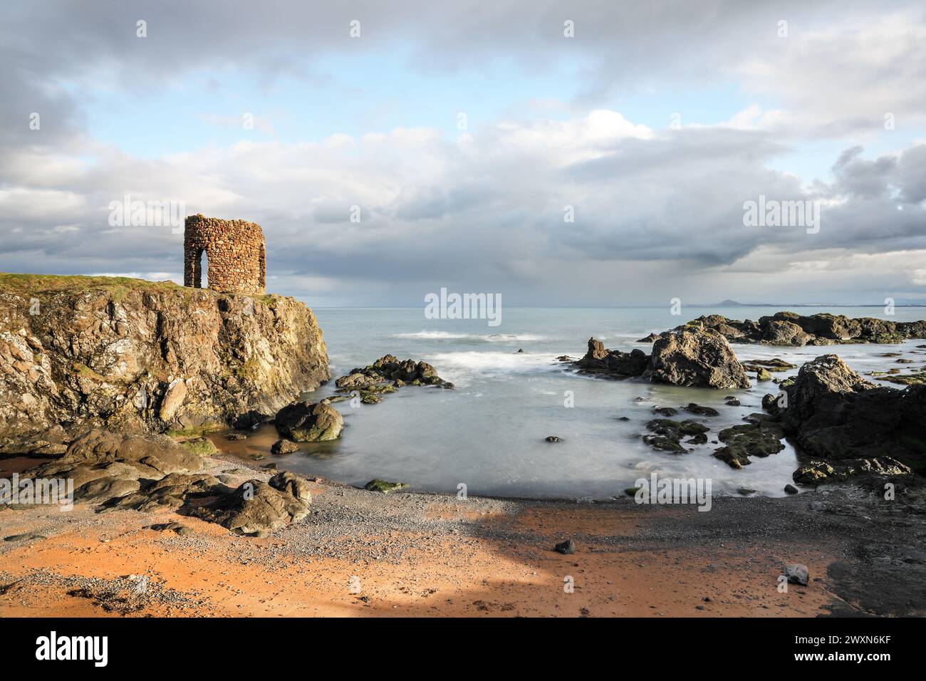 Lady’s Tower illuminated by late afternoon light, Ruby Bay, Elie, Fife ...