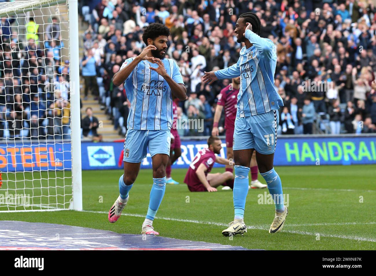 Coventry City's Ellis Simms (left) celebrates scoring their side's ...