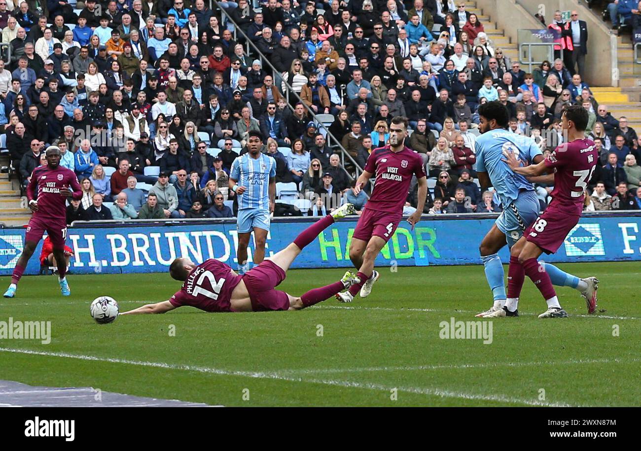 Coventry City's Ellis Simms (second right) scores their side's first ...