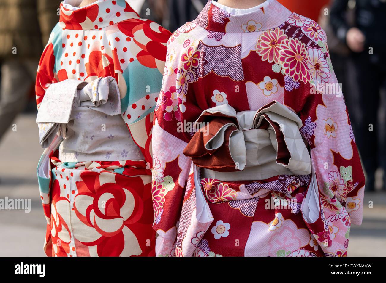 Young girl wearing Japanese kimono standing in front of Sensoji Temple ...