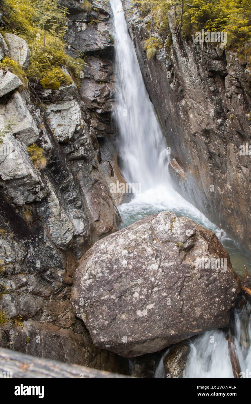 The majestic Obrovsky waterfall in Slovakia with rocky surroundings ...