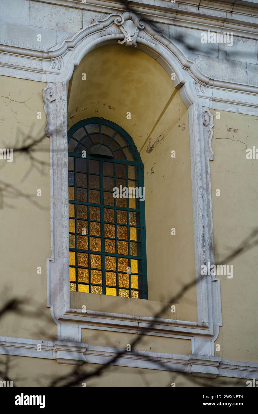 Baroque Window With Radiant Yellow Light on an Elegant European Façade ...