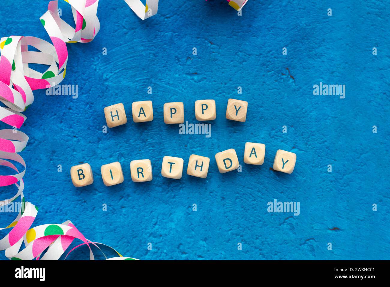 Happy birthday greeting card with wooden letter blocks and a serpentine ...