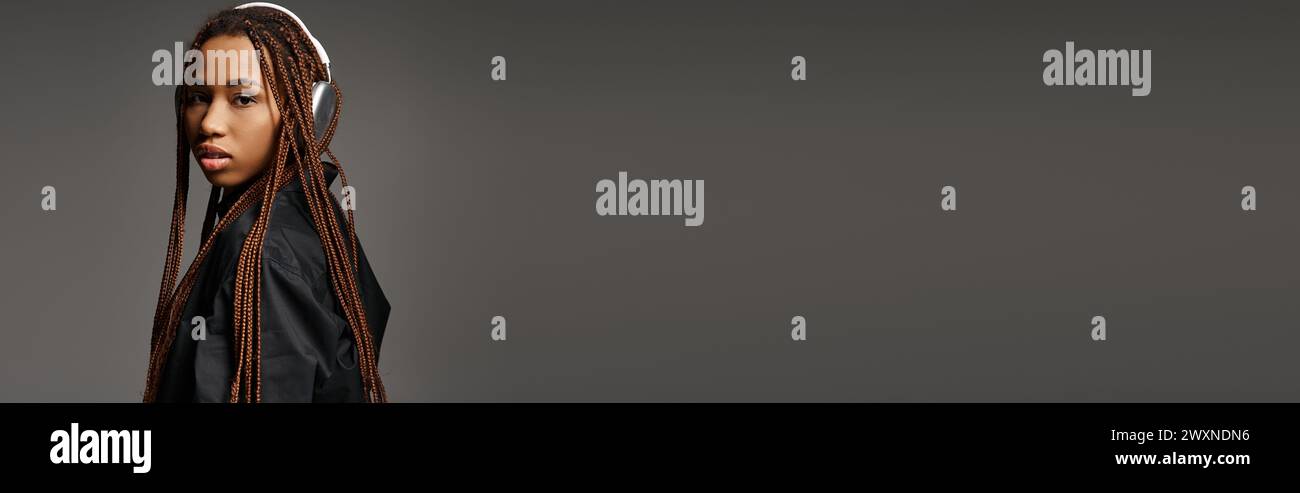 pretty african american girl with dreadlocks listening music in ...