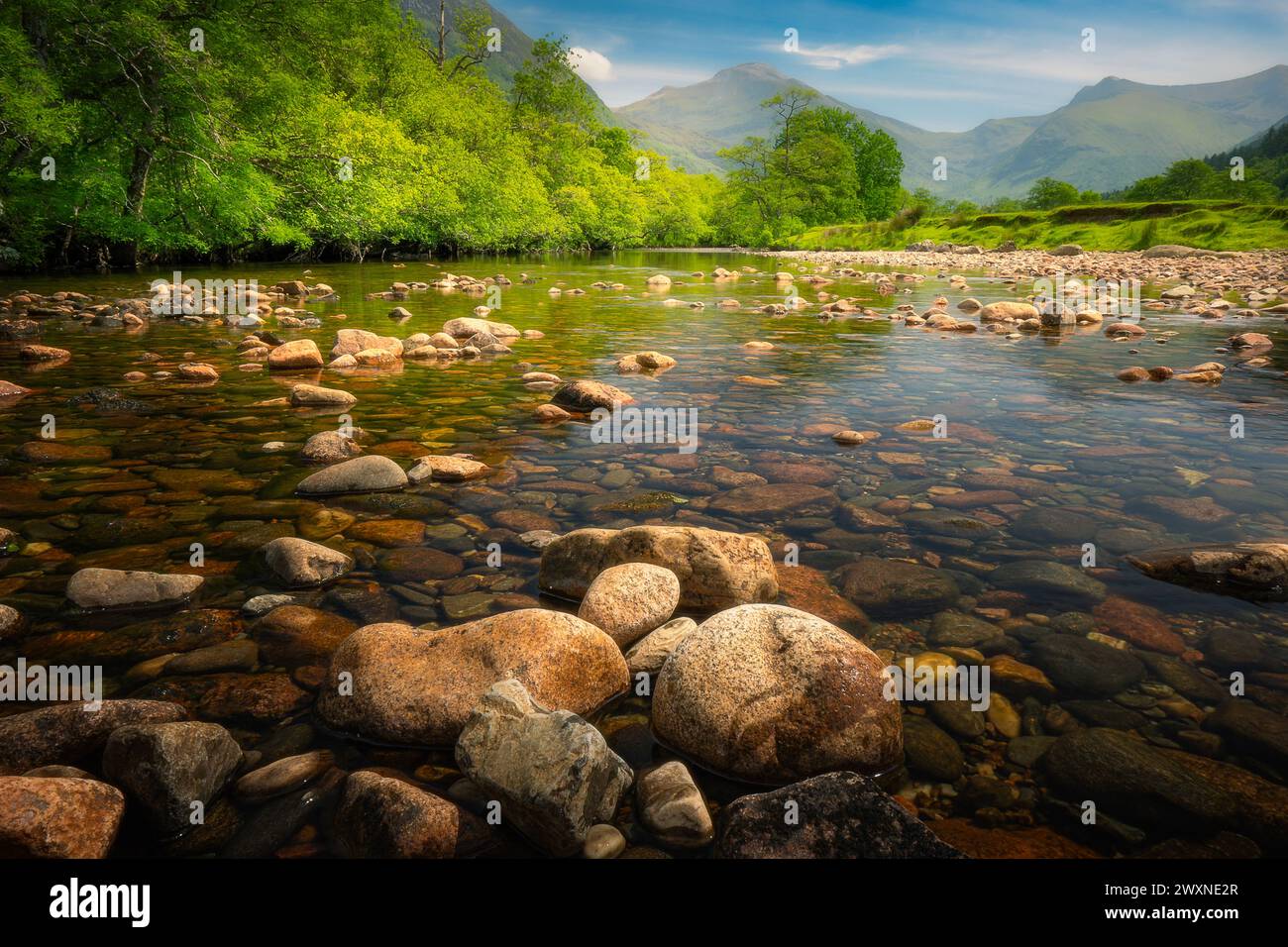Framed by green hills and majestic mountains hi-res stock photography ...