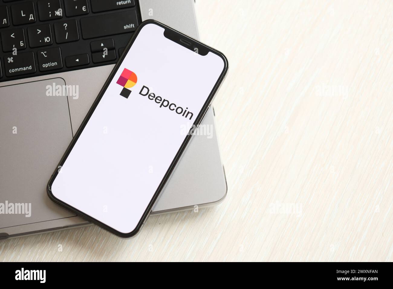 KYIV, UKRAINE - MARCH 15, 2024 Deepcoin logo on iPhone display screen ...
