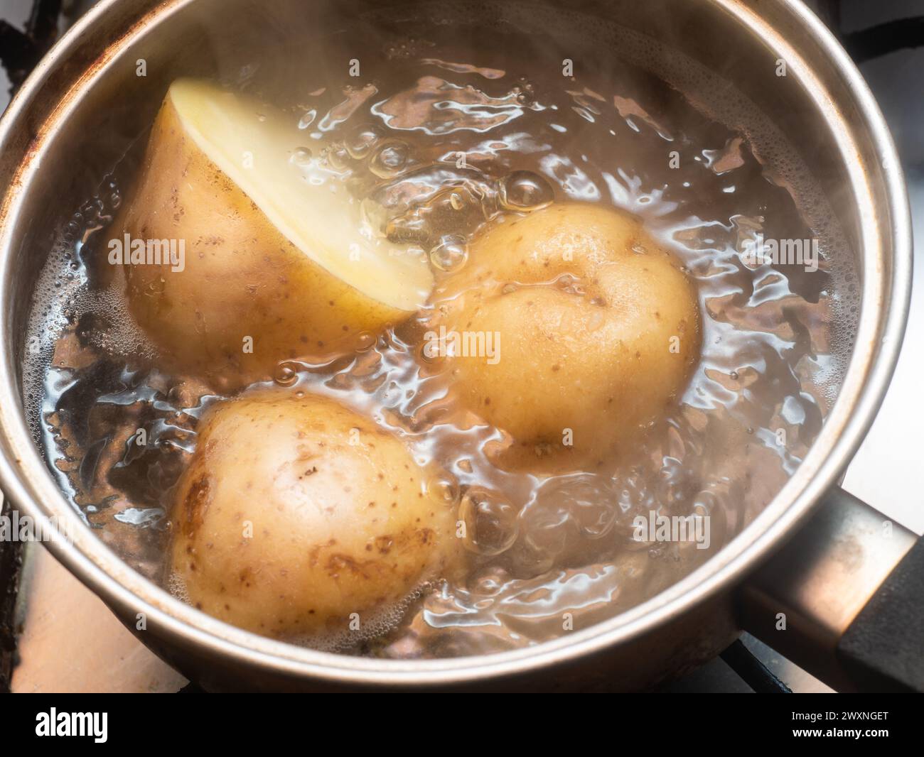 Cooking potatoes in hot water hi-res stock photography and images - Alamy