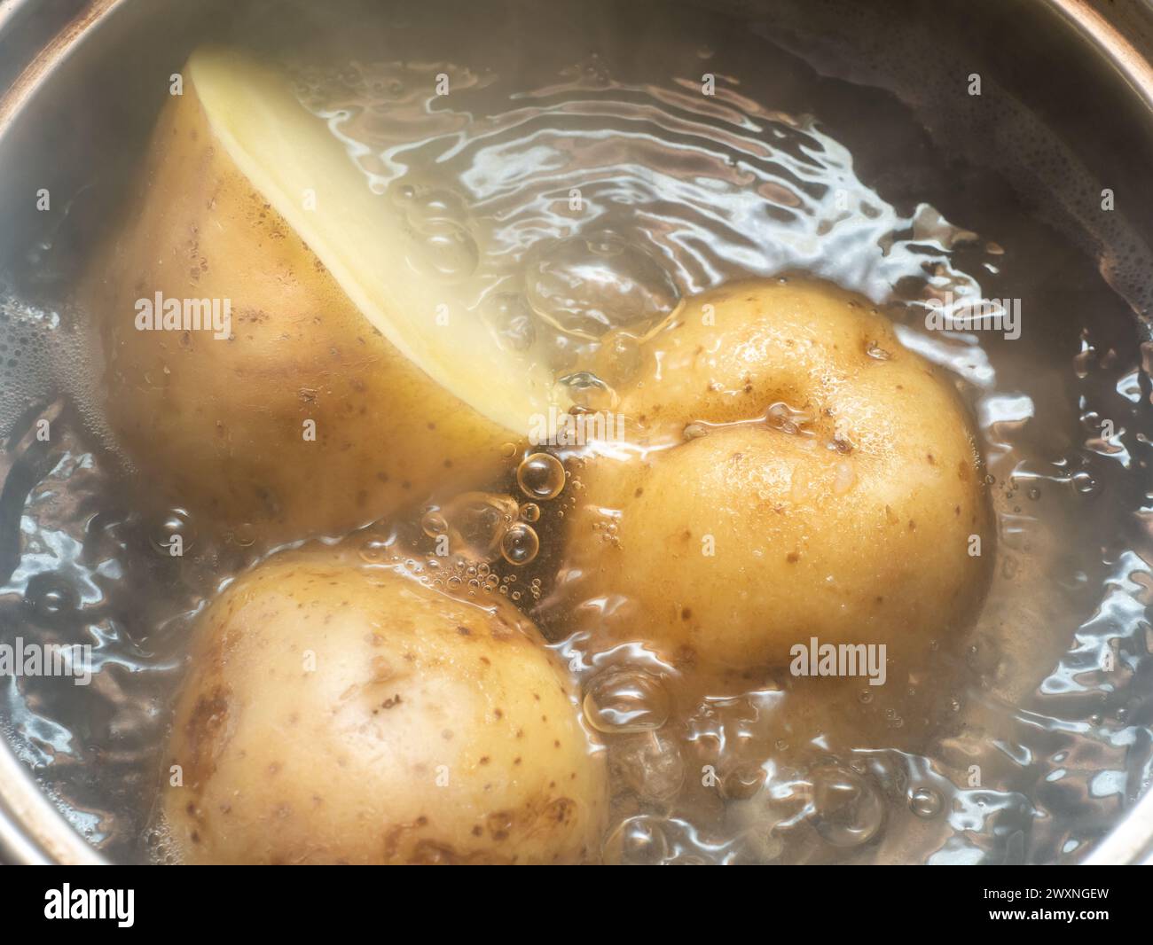 Cooking potatoes in hot water hi-res stock photography and images - Alamy