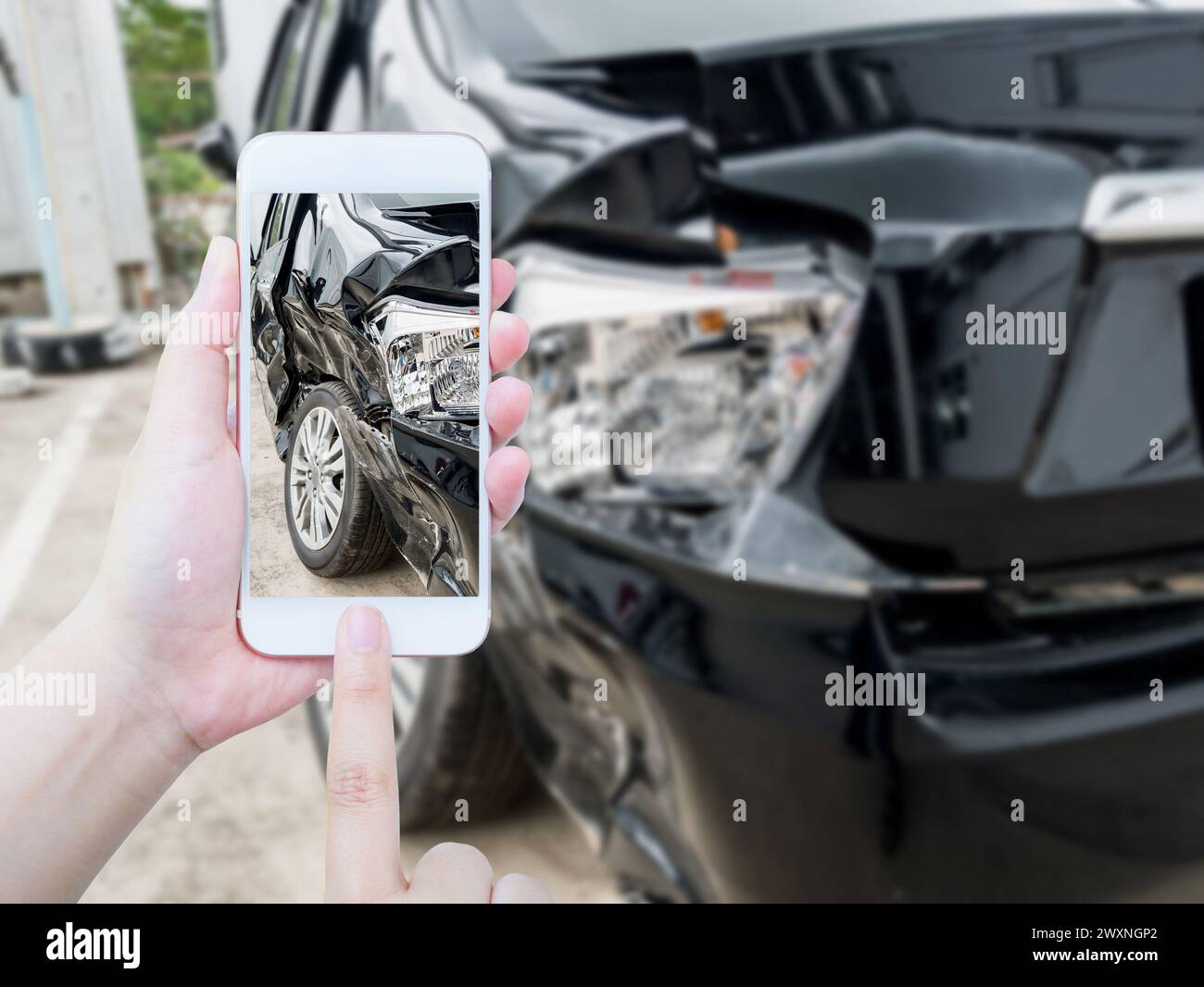 female hold mobile smartphone photographing car accident for insurance ...