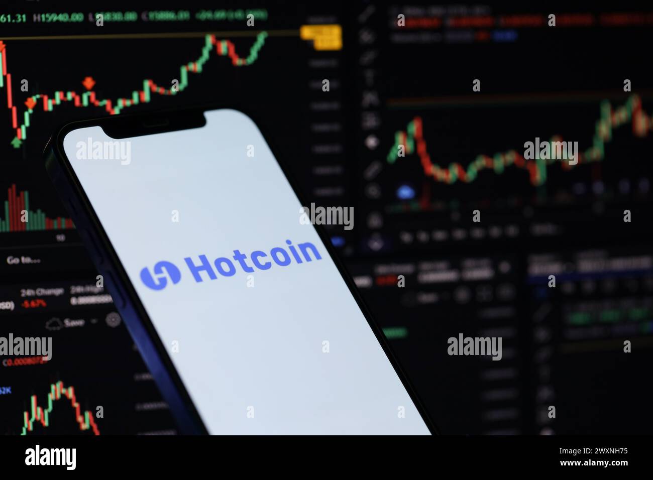KYIV, UKRAINE - MARCH 15, 2024 Hotcoin logo on iPhone display screen ...