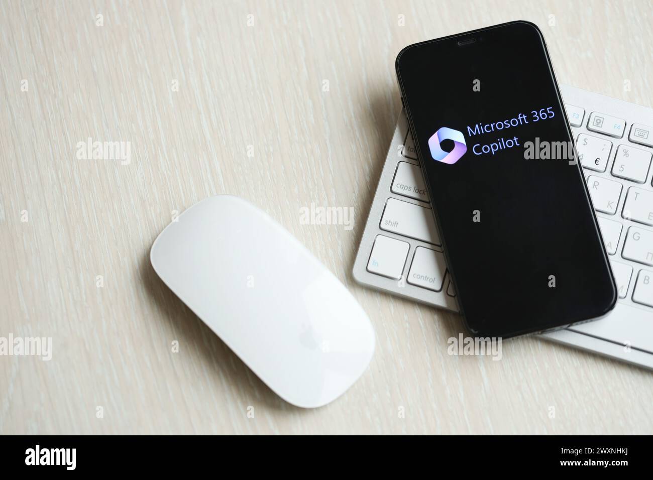 KYIV, UKRAINE - MARCH 17, 2024 Microsoft Copilot logo on iPhone display screen with apple ...