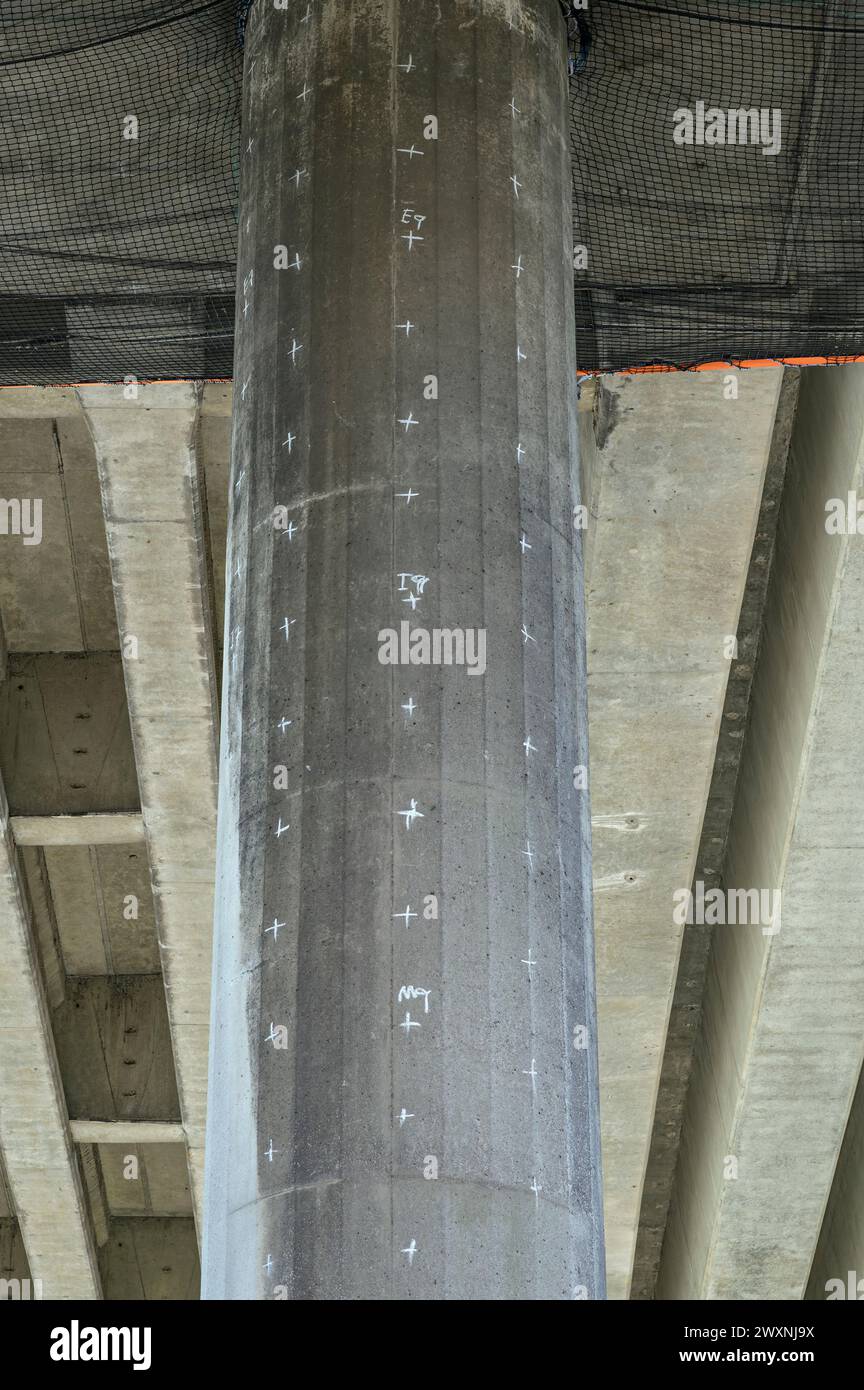Surveyor's chalk grid on a concrete column supporting a motorway ...