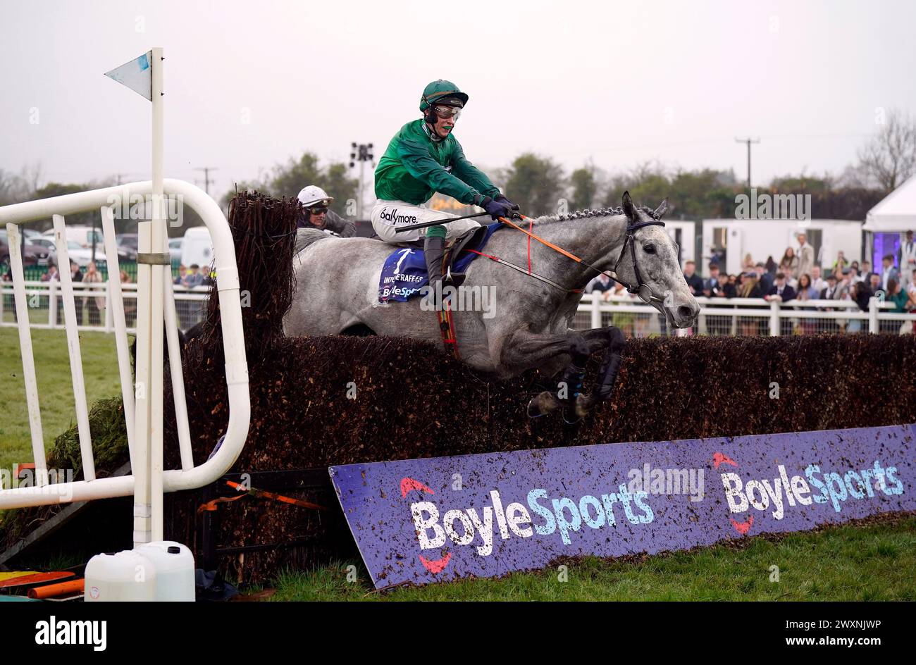 Intense Raffles ridden by jockey J J Slevin clear a fence on their way ...