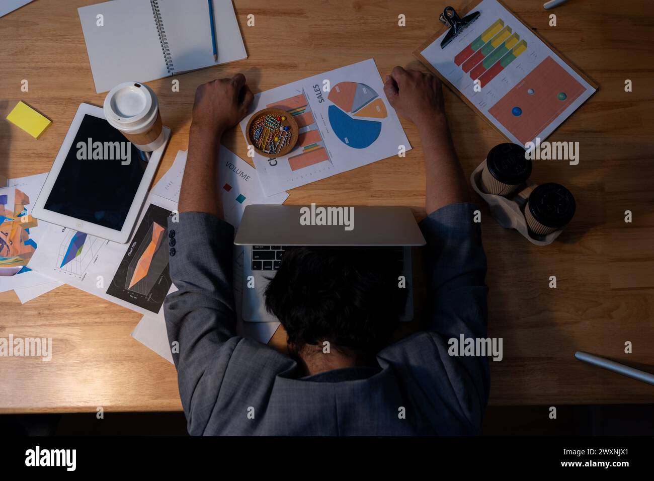 The man who worked late fell asleep with his laptop still at work Stock ...