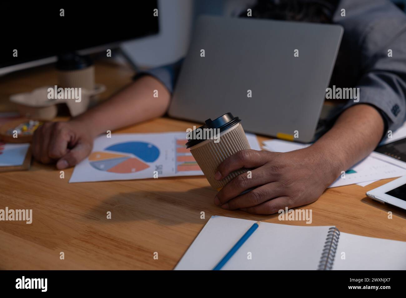 The man who worked late fell asleep with his laptop still at work Stock ...