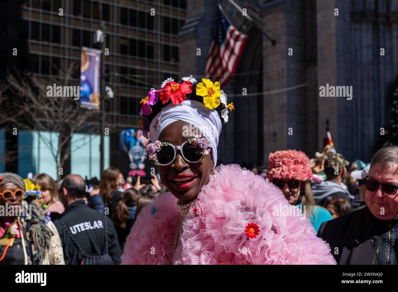 New York, New York, USA, 31 March 2024. Revelers stroll and pose along ...
