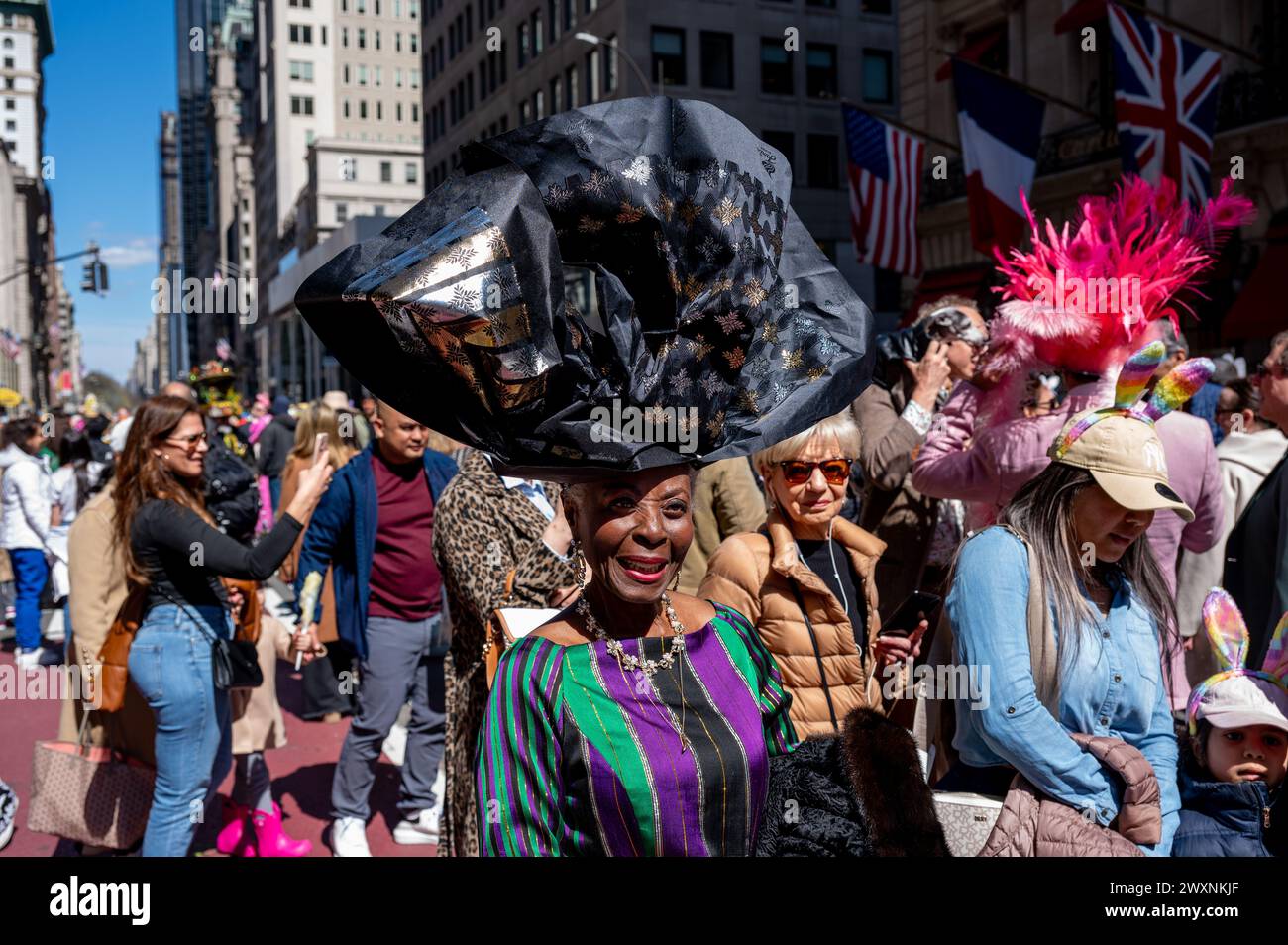 New York, New York, USA, 31 March 2024. Revelers stroll and pose along ...