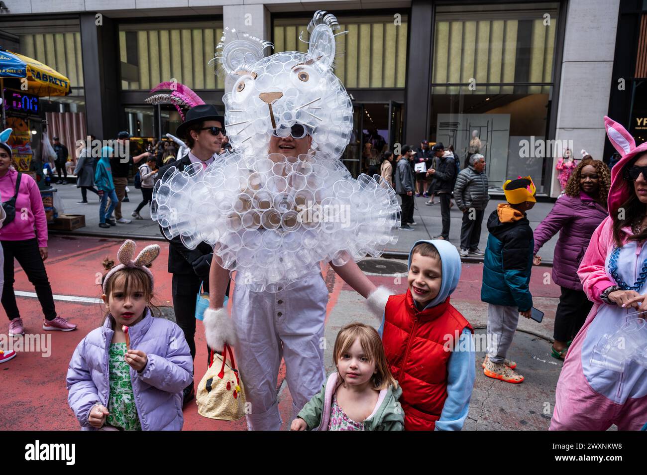 New York, New York, USA, 31 March 2024. Revelers stroll and pose along ...